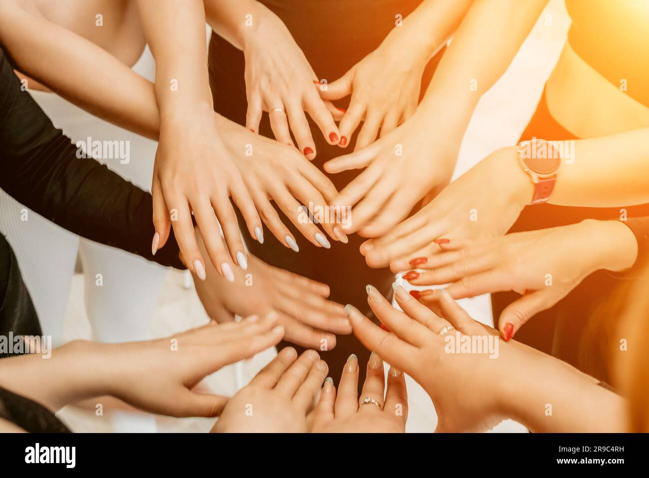 Partnership and unity concept: unrecognizable women in sportswear ...