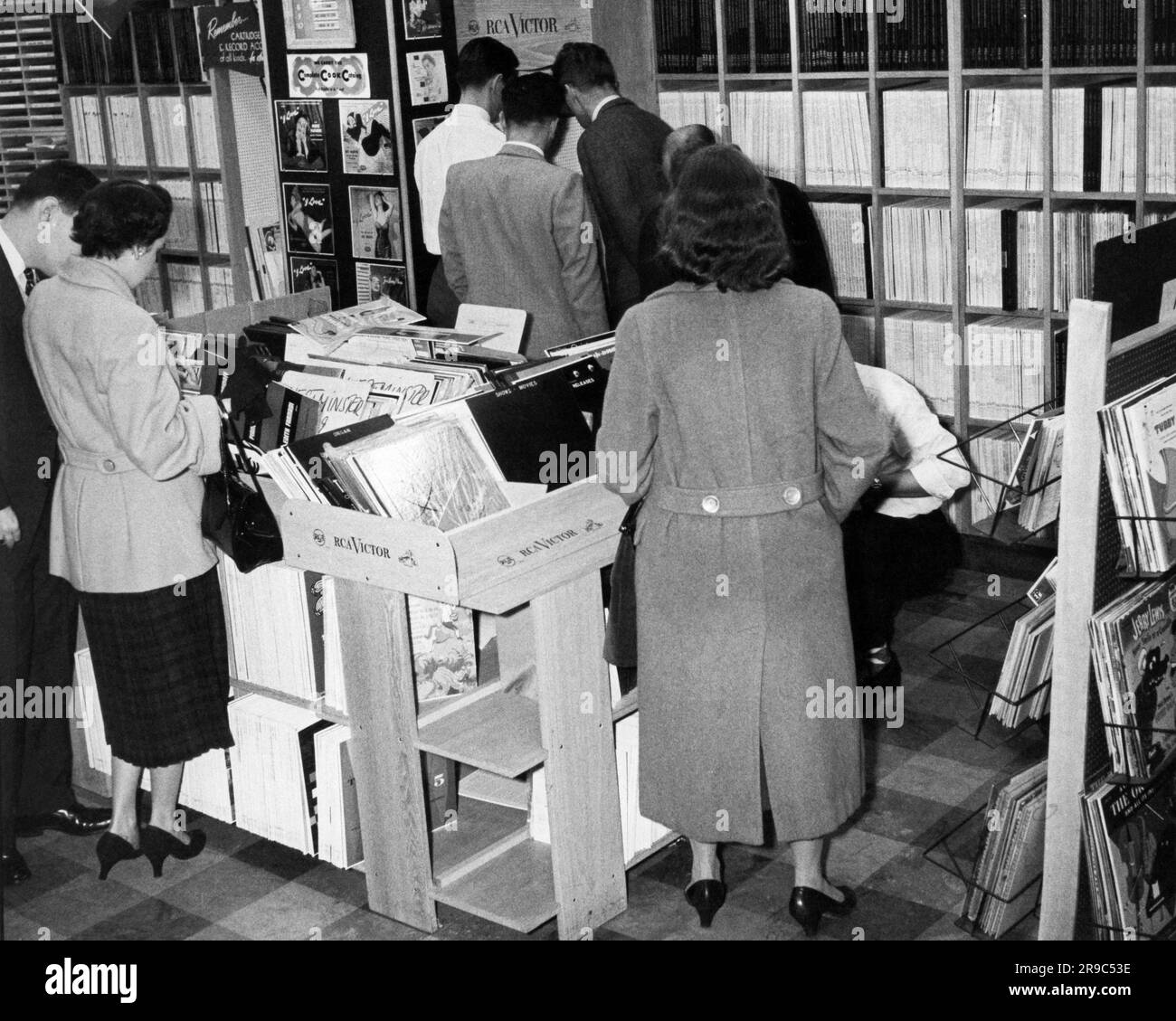 New York, New York: October, 1955 Customers perusing the wide ...