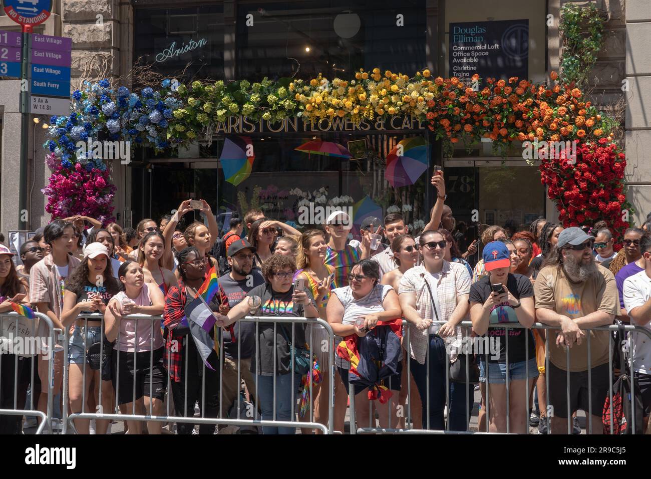 NEW YORK, NEW YORK - JUNE 25: Spectators watch the annual New York City Pride Parade on June 25 ...