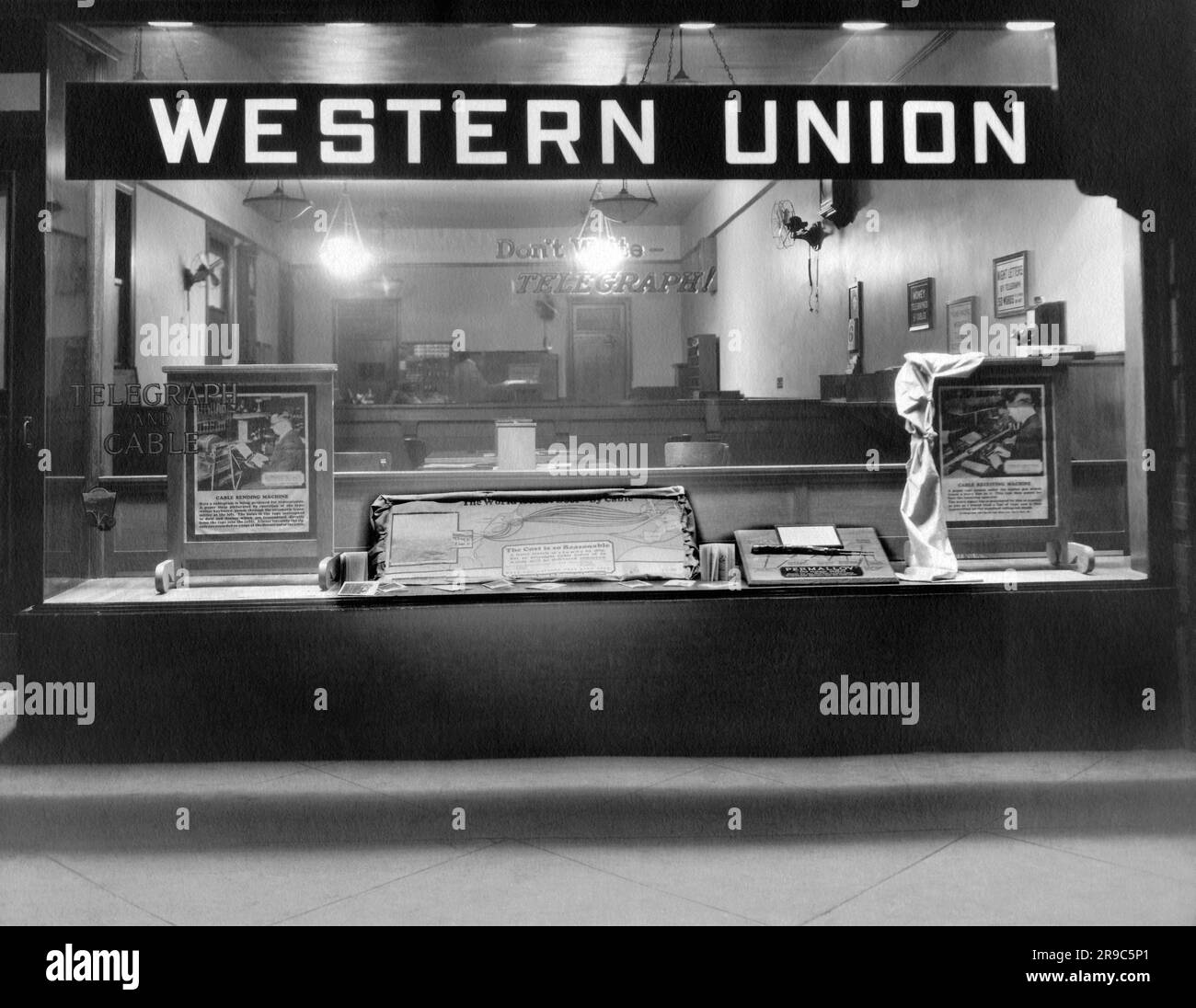 United States: c. 1933 Night time view of a Western Union telegraph ...