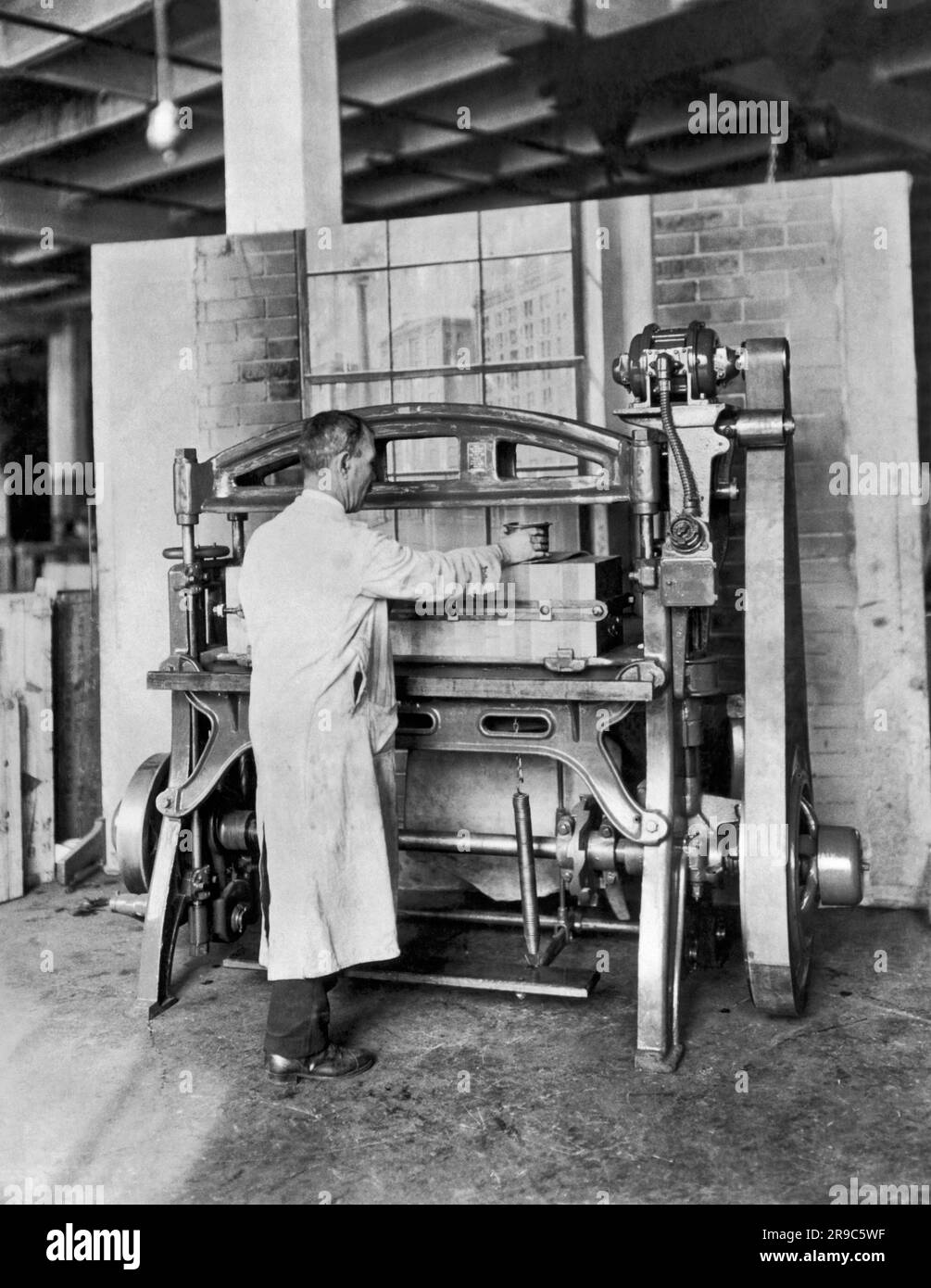 Industrial worker working on machine Black and White Stock Photos ...