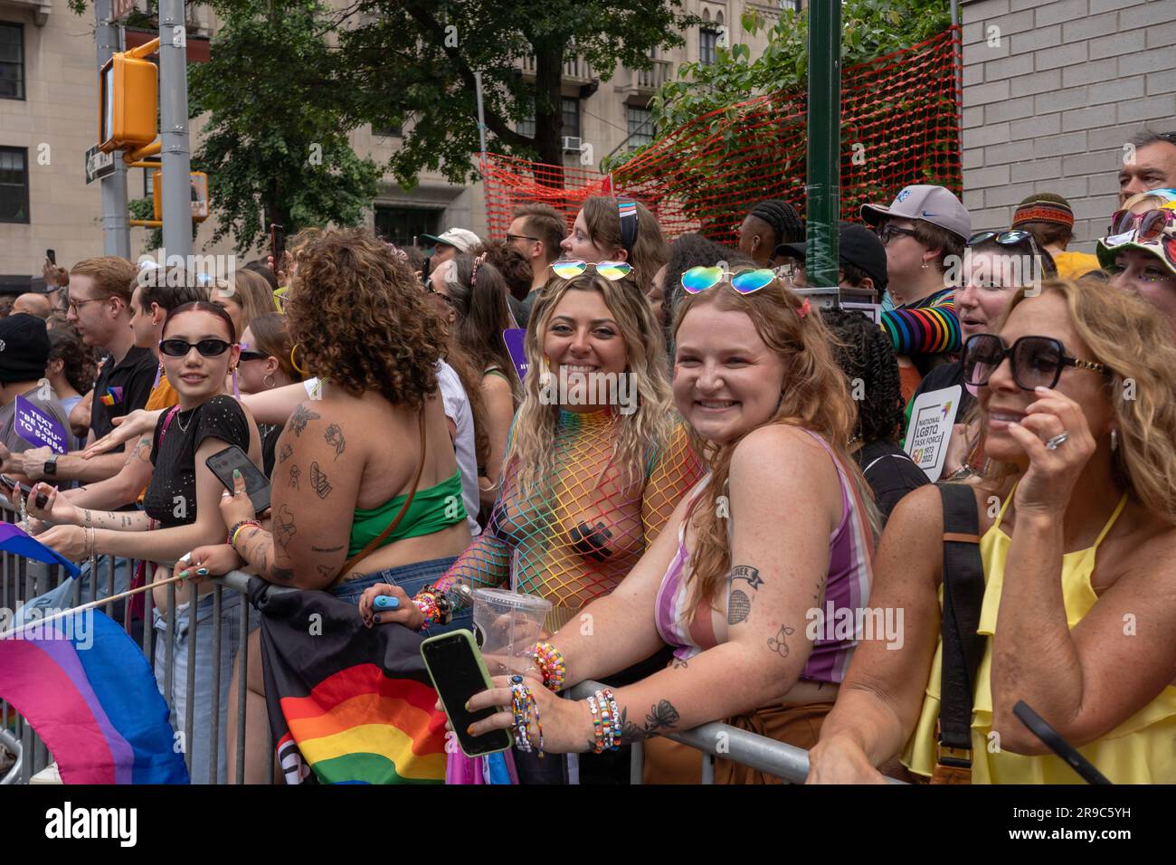 NEW YORK, NEW YORK - JUNE 25: Spectators watch the annual New York City Pride Parade on June 25 ...