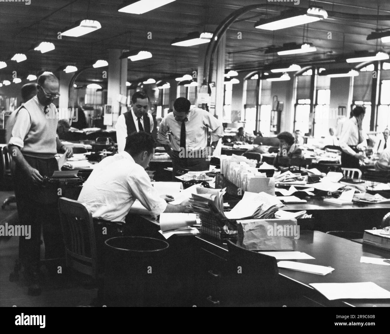 California: c. 1938 The city room or main news room of a newspaper ...