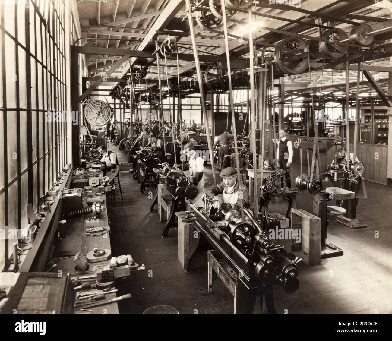 San Francisco, California: c. 1910 Workers in a factory with lathes and ...