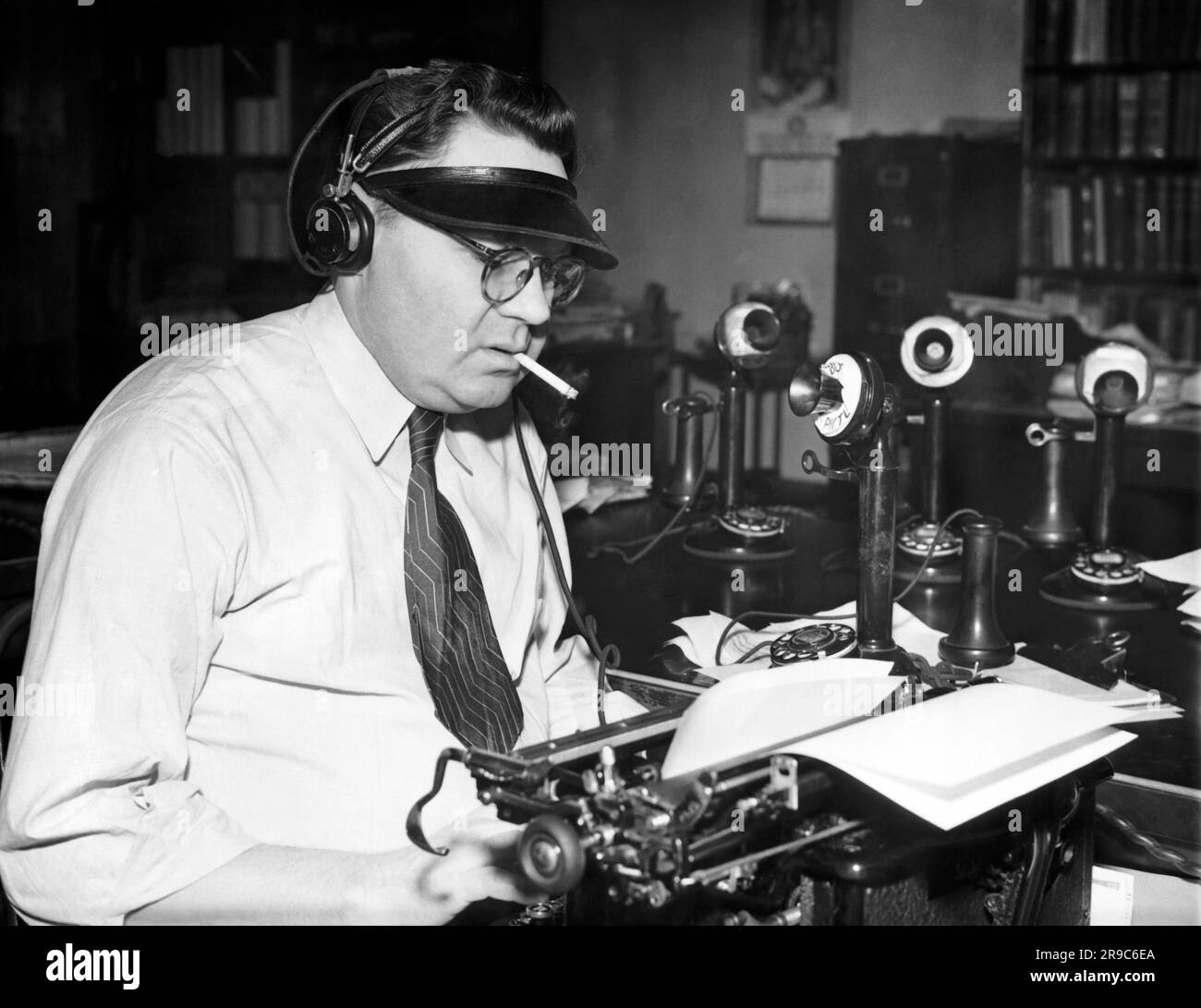 United States: October, 1929 A newspaper man works at his typewriter ...