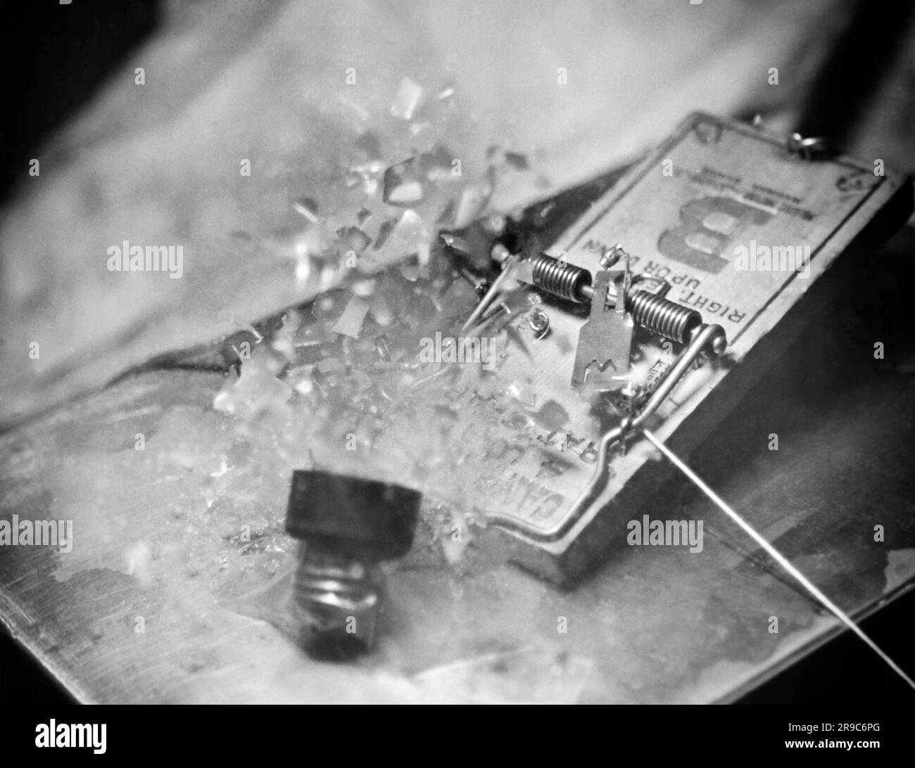 United States: c. 1948 High speed photograph of a light bulb being ...