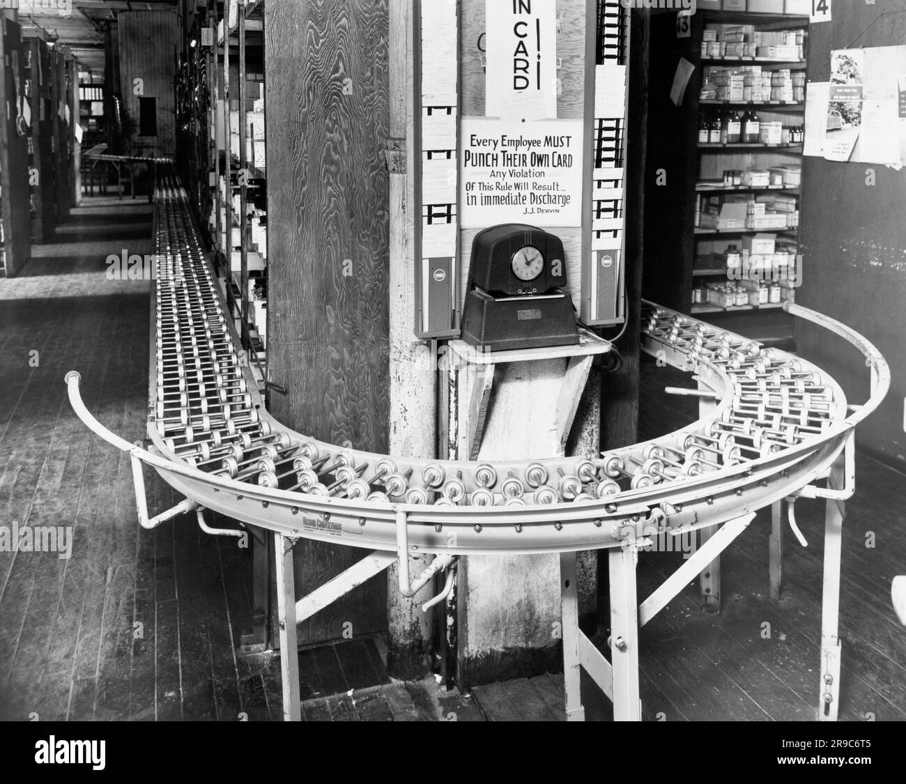 Chicago, Illinois: c. 1955 An employee time card clock behind a ...