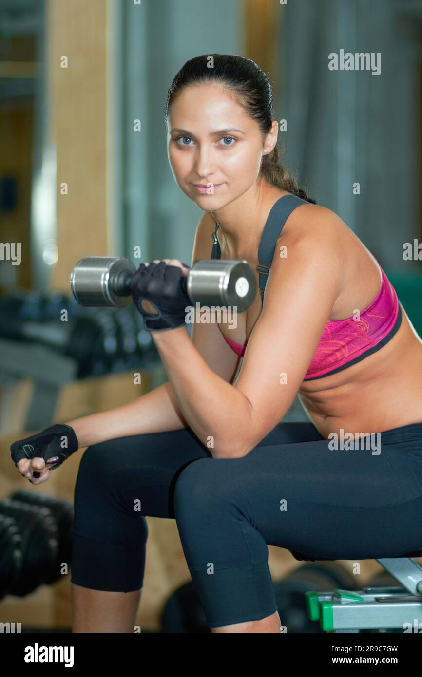 Portrait, woman and dumbbell workout in gym for power, exercise and ...