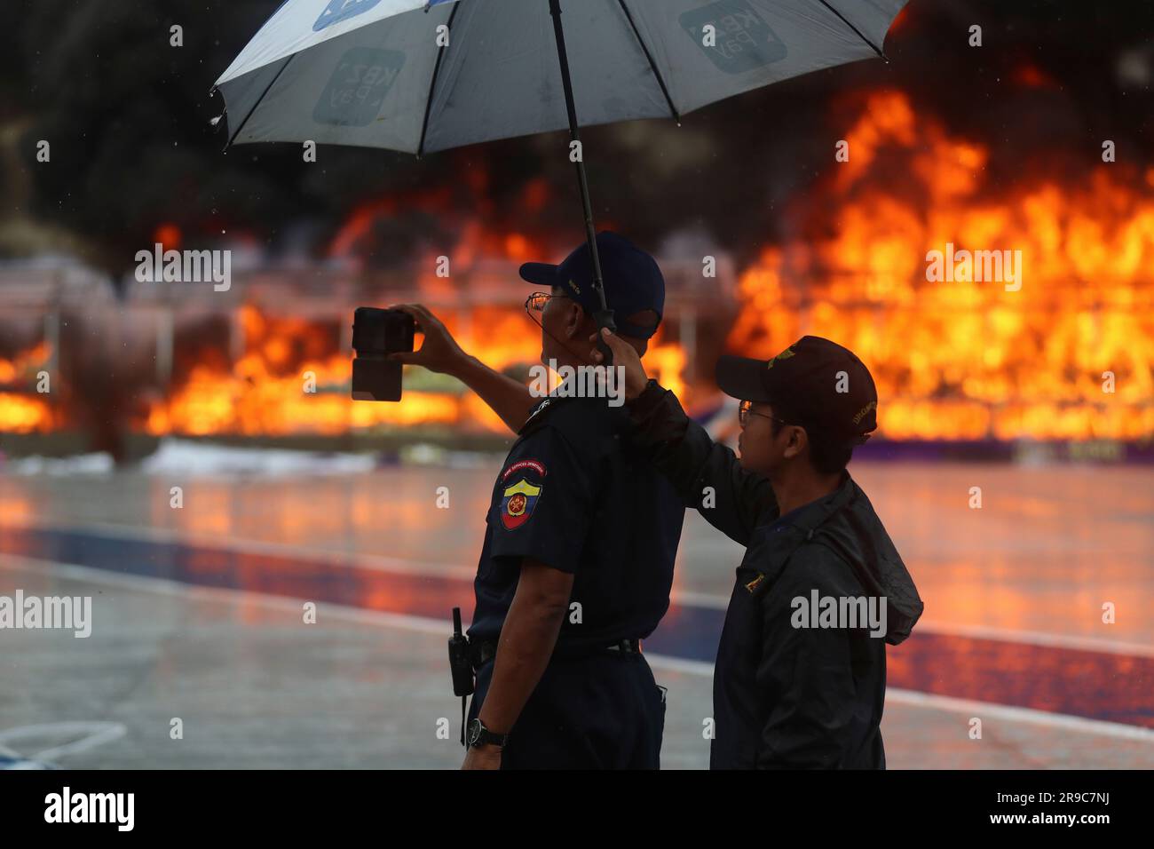 Members of Myanmar Fire Service Department take photos with their ...