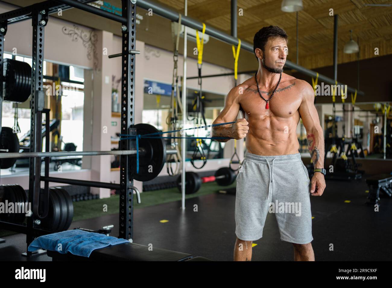 Photo with copy space of an athletic man exercising the arm with an ...