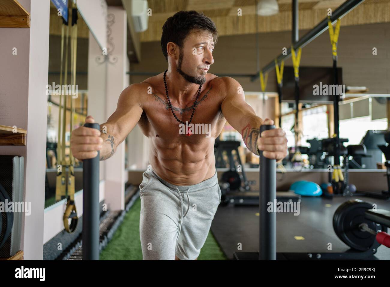 Man strain weights hi-res stock photography and images - Alamy