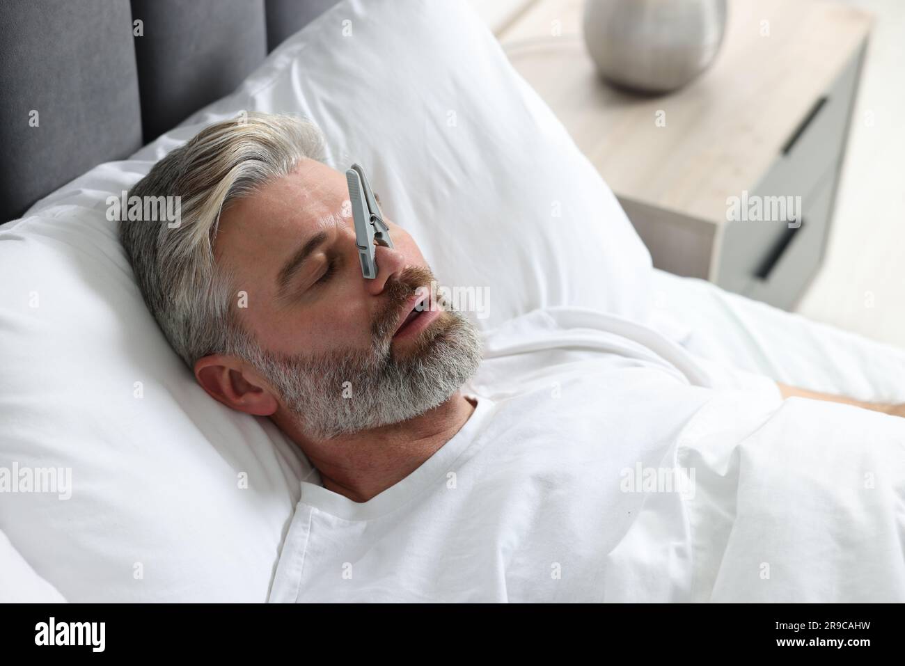 Man clothespin nose hi-res stock photography and images - Alamy