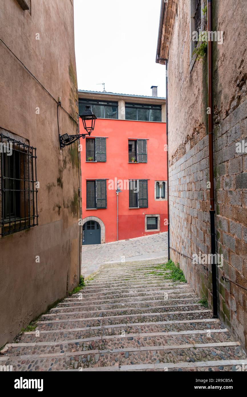 Beautiful streets of Girona old town with ancient buildings and ...