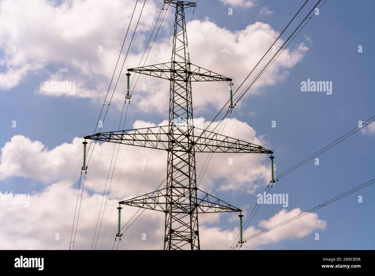 High voltage towers with sky background. Power line support with wires ...