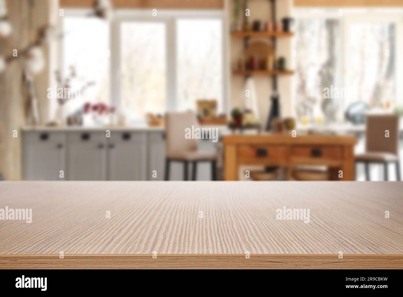 Empty wooden table in beautiful kitchen. Space for design Stock Photo ...