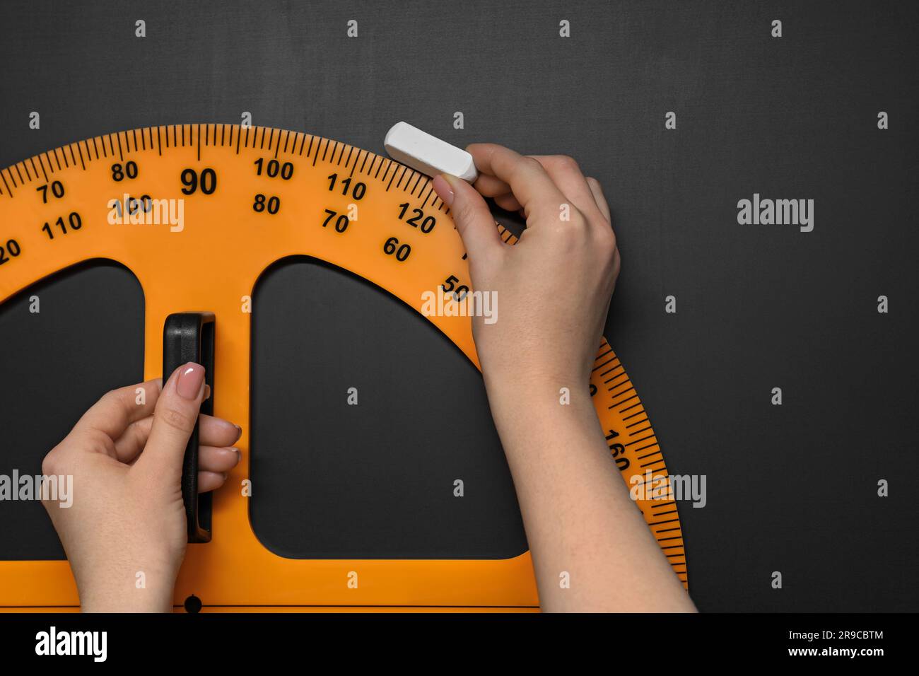 Hands measuring angle by protractor hi-res stock photography and images ...