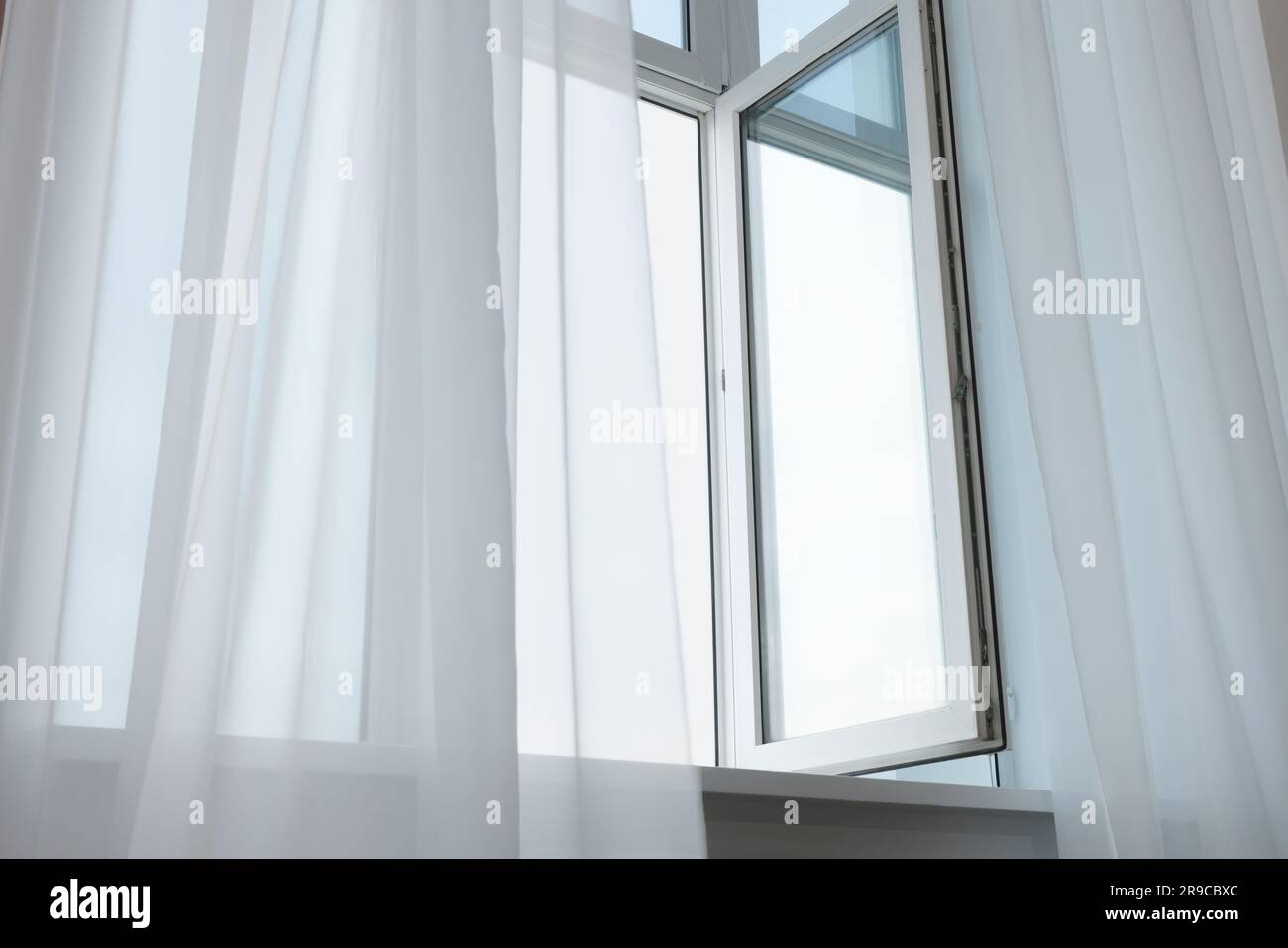 Open window and elegant white curtains indoors. Interior design Stock ...