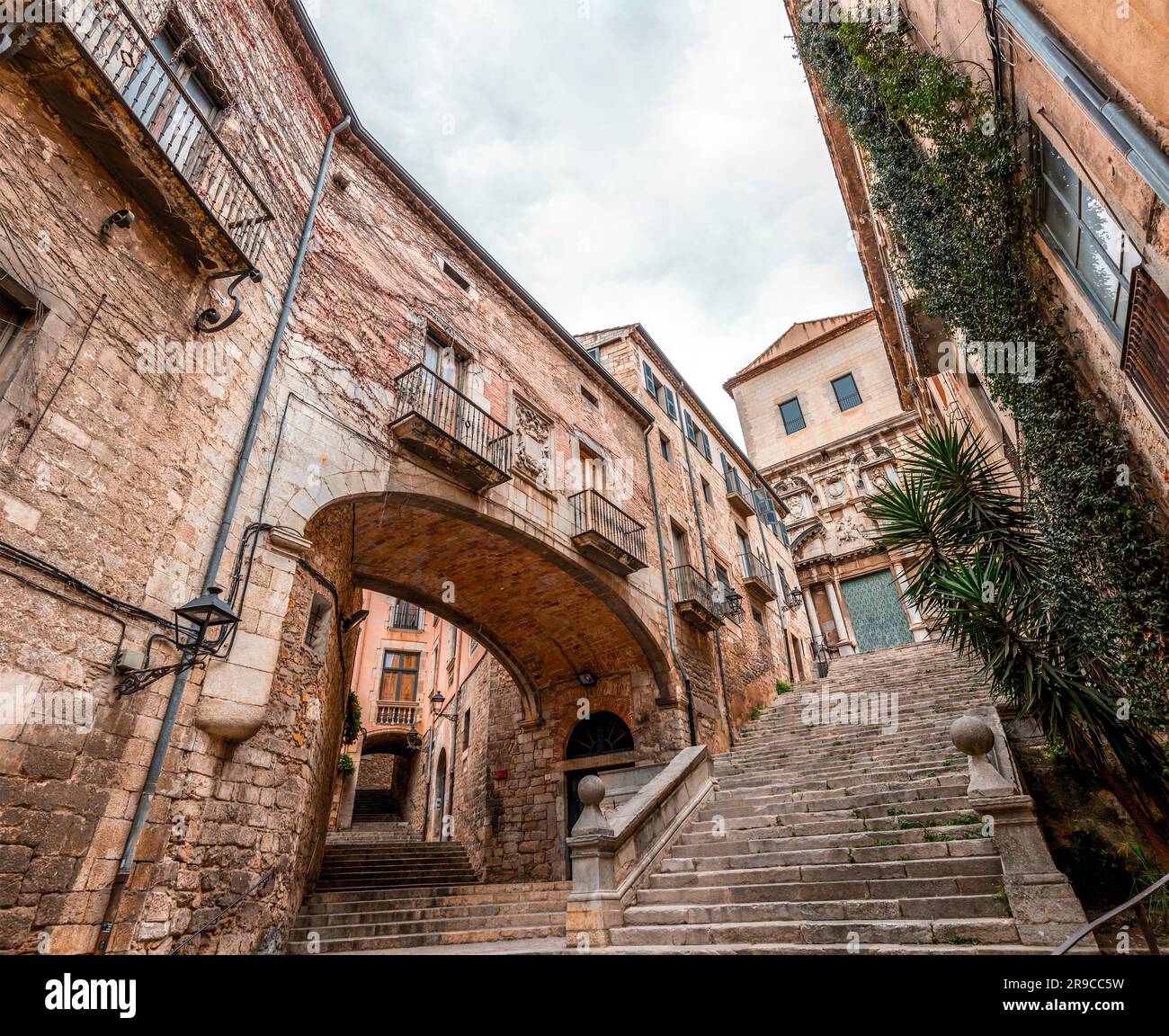 Beautiful streets of Girona old town with ancient buildings and ...