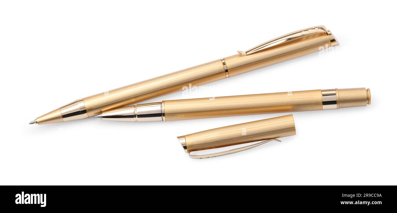 New stylish golden pens isolated on white, top view Stock Photo - Alamy