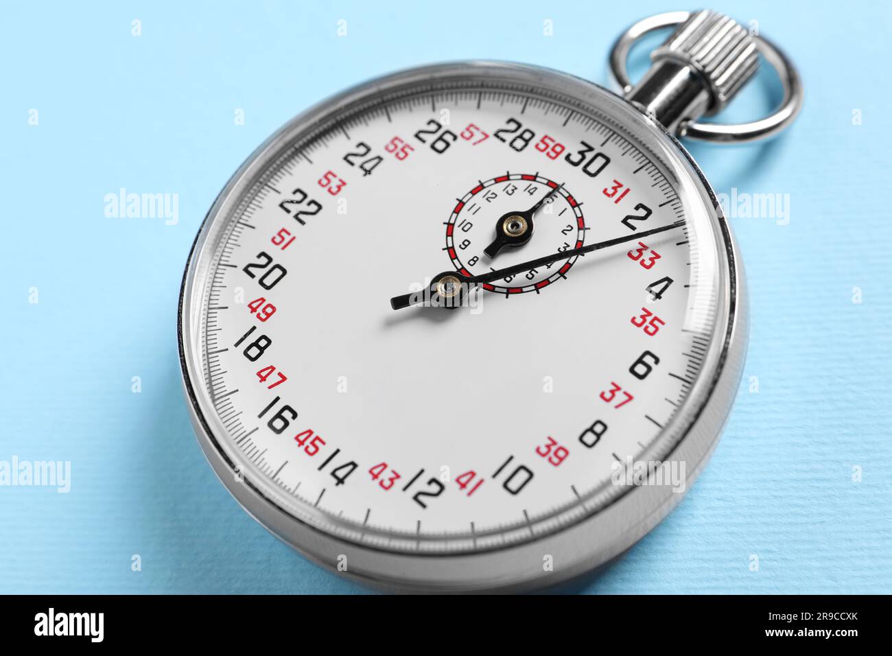 Vintage timer on light blue background, closeup. Measuring tool Stock ...