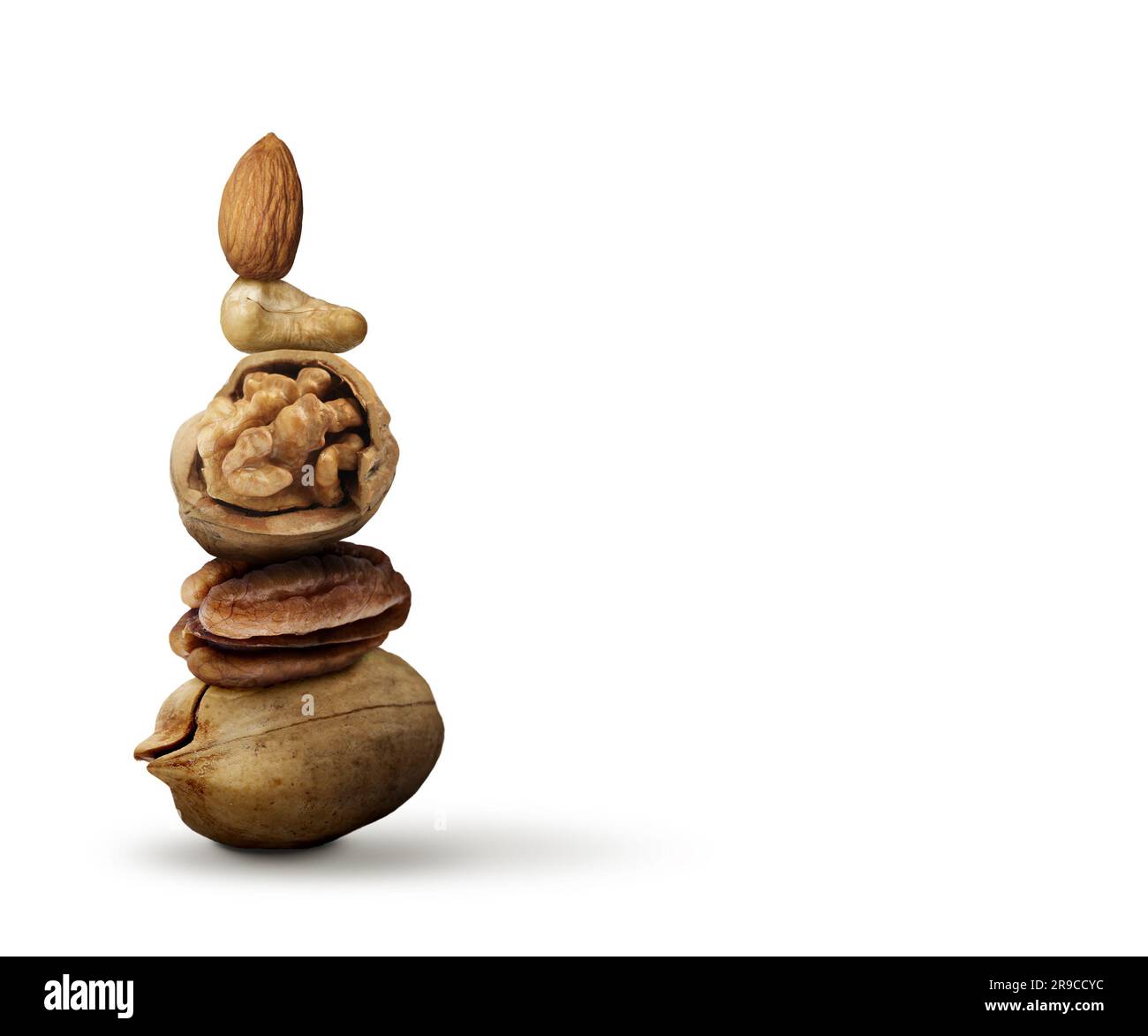 Stack of different nuts on white background Stock Photo - Alamy