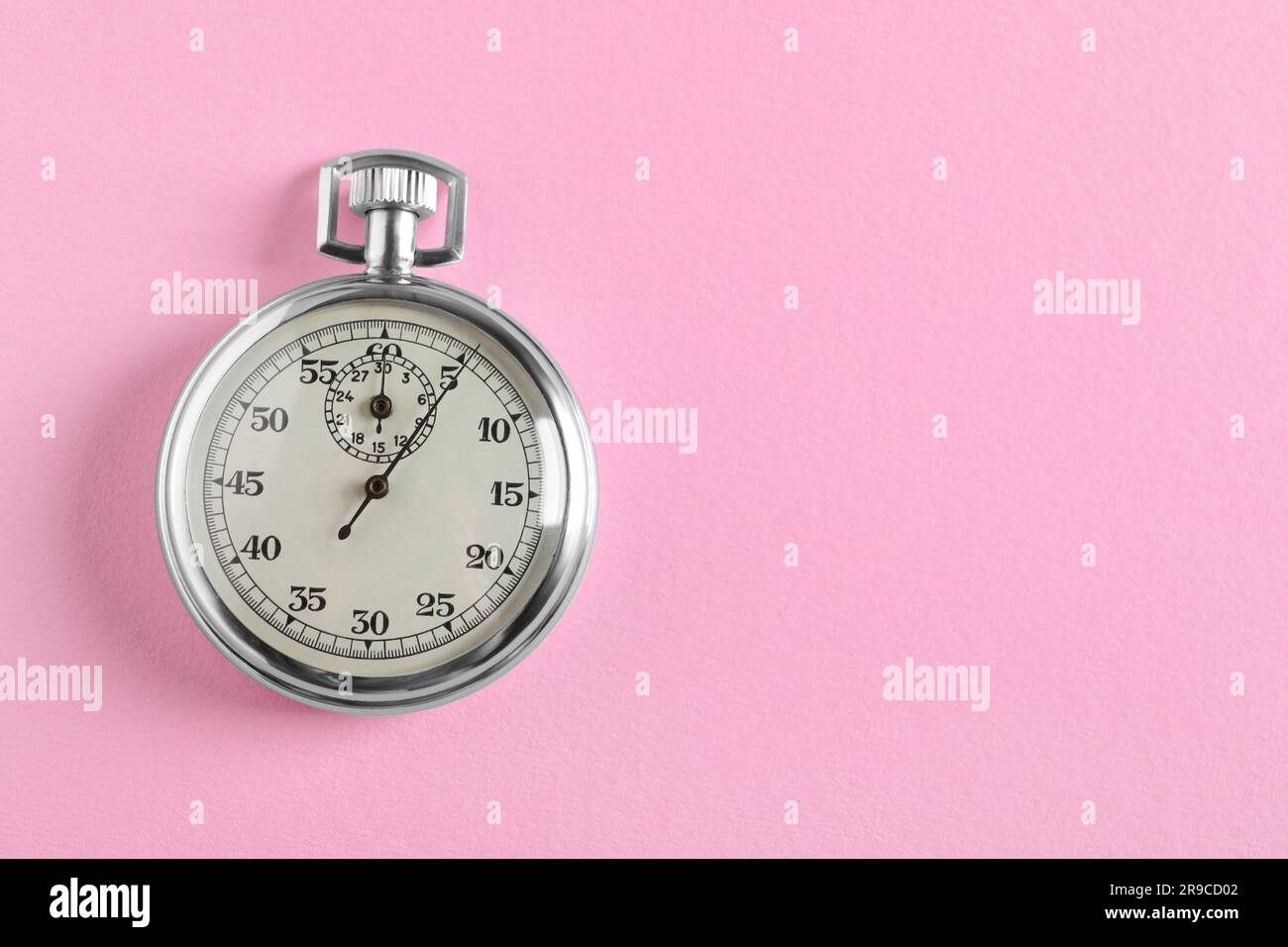 Vintage timer on pink background, top view with space for text ...