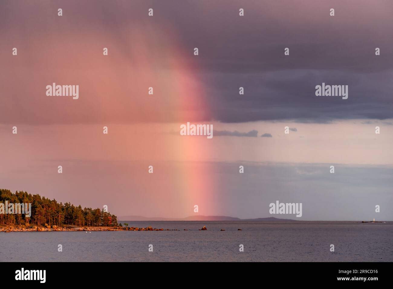 In the horizon Russian Suursaari island below the rainbow, seen from ...
