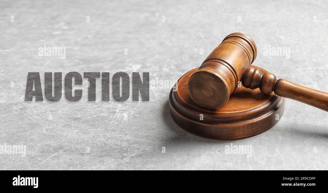 Auction. Wooden gavel on grey textured table, banner design Stock Photo ...