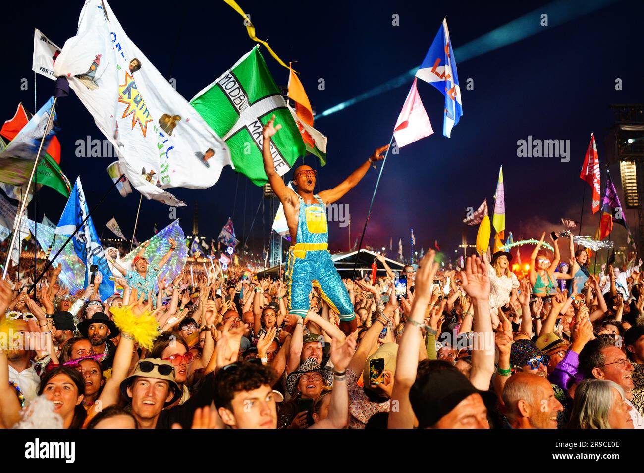 EDITORIAL USE ONLY Crowds watch Elton John performing on the Pyramid ...
