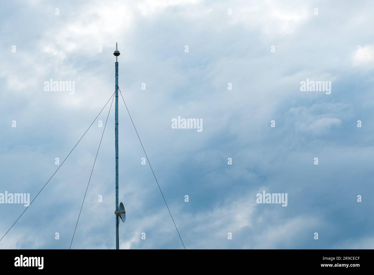 Radioactive lightning interception rod against dark stormy sky ...
