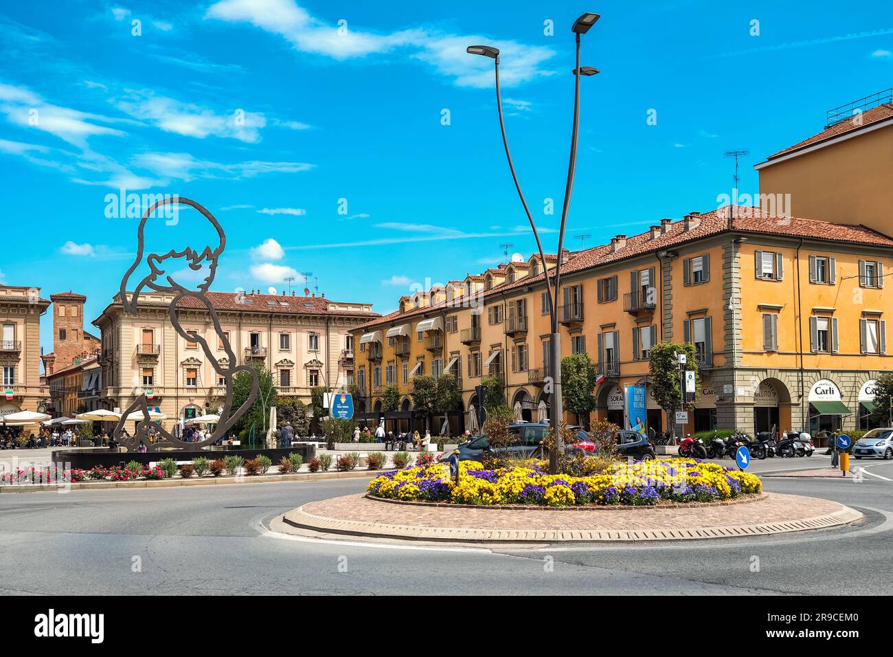 Lamppost on roundabout decorated with flowers as central square with ...