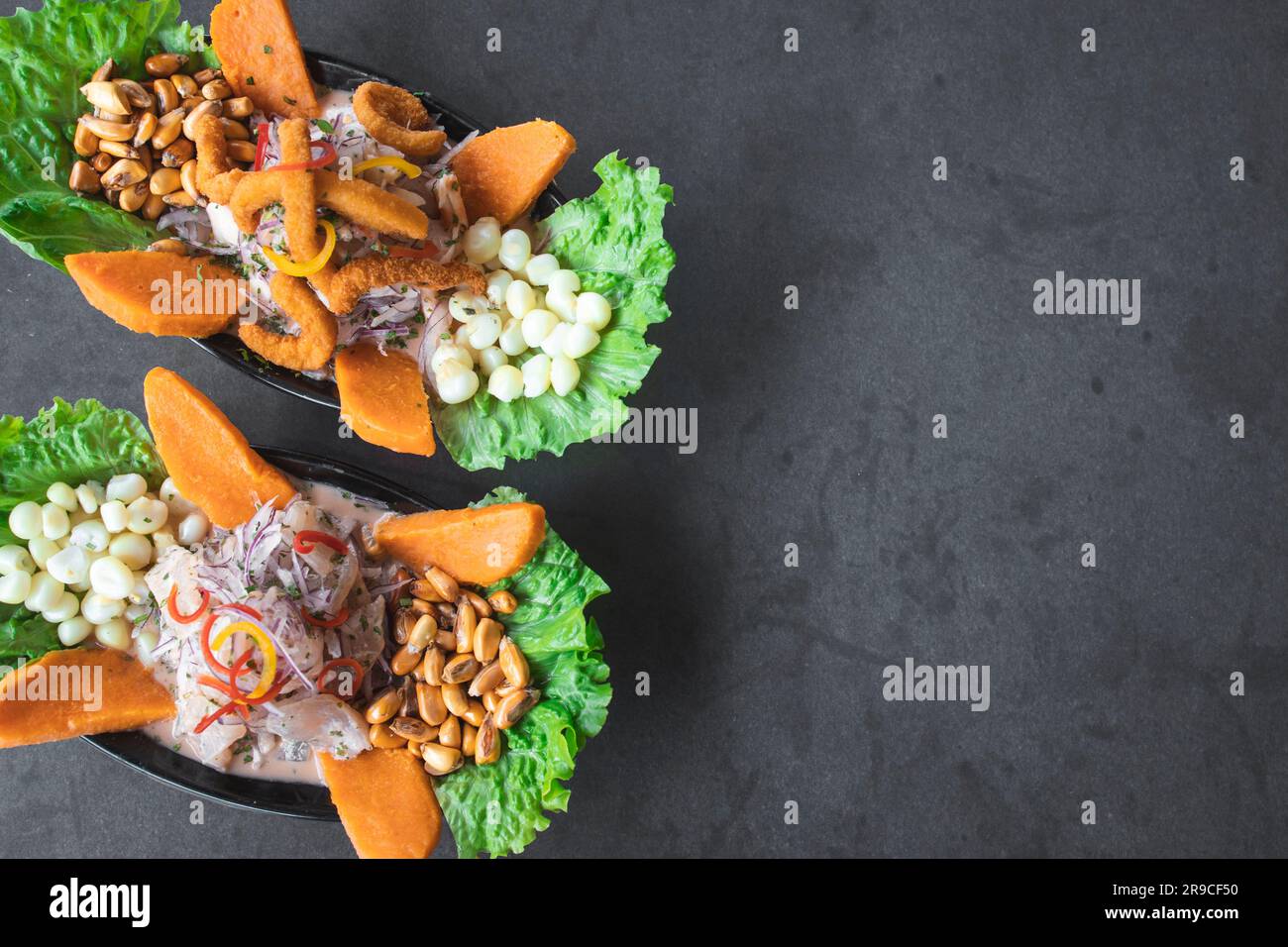 Peruvian eviction with fresh fish, seafood, on rustic stone background ...