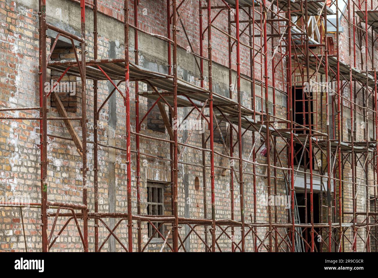 Scaffolding structure on construction site, renovation of an old ...