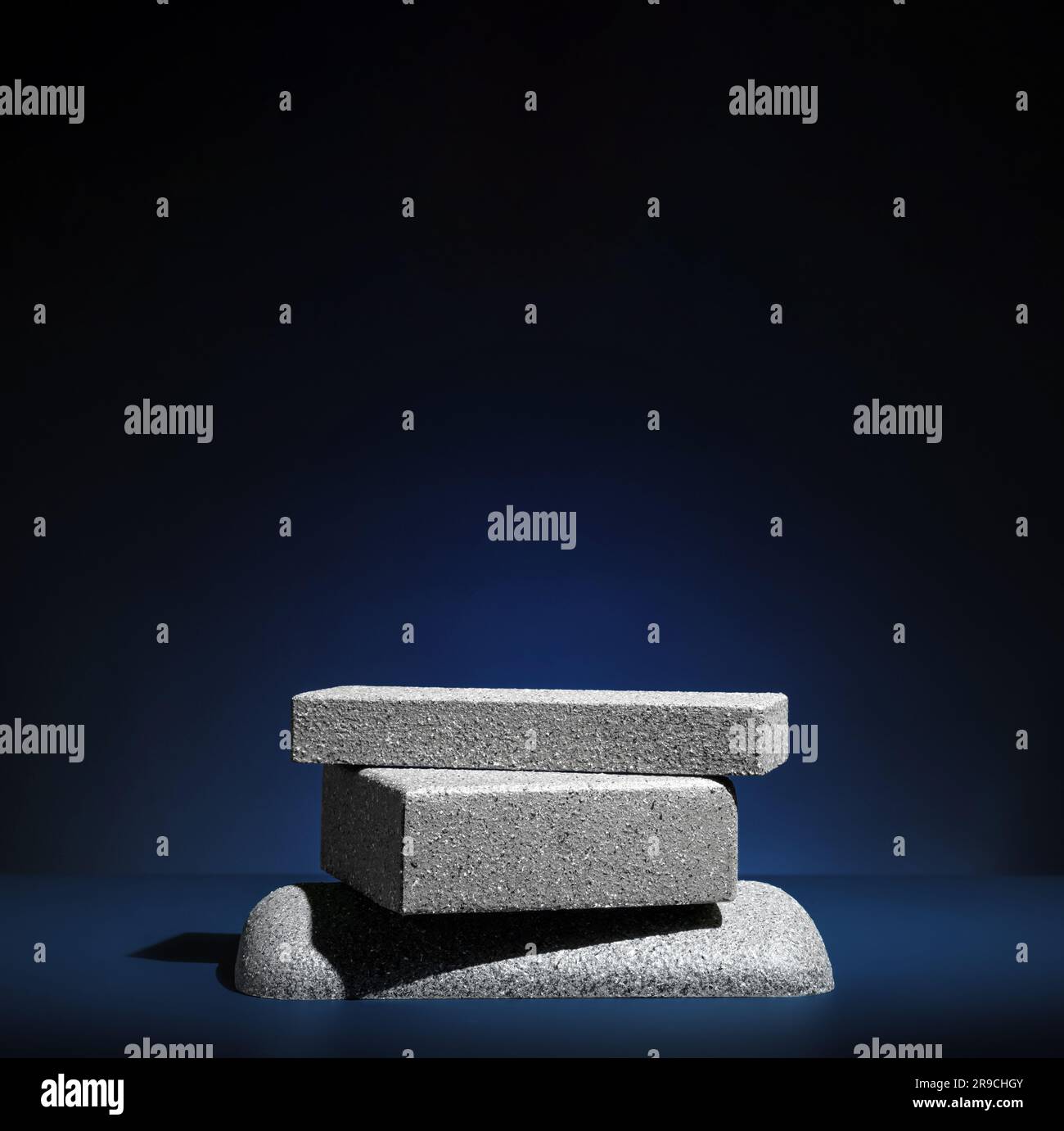 Stone block pedestal stage product display background on navy color.zen ...