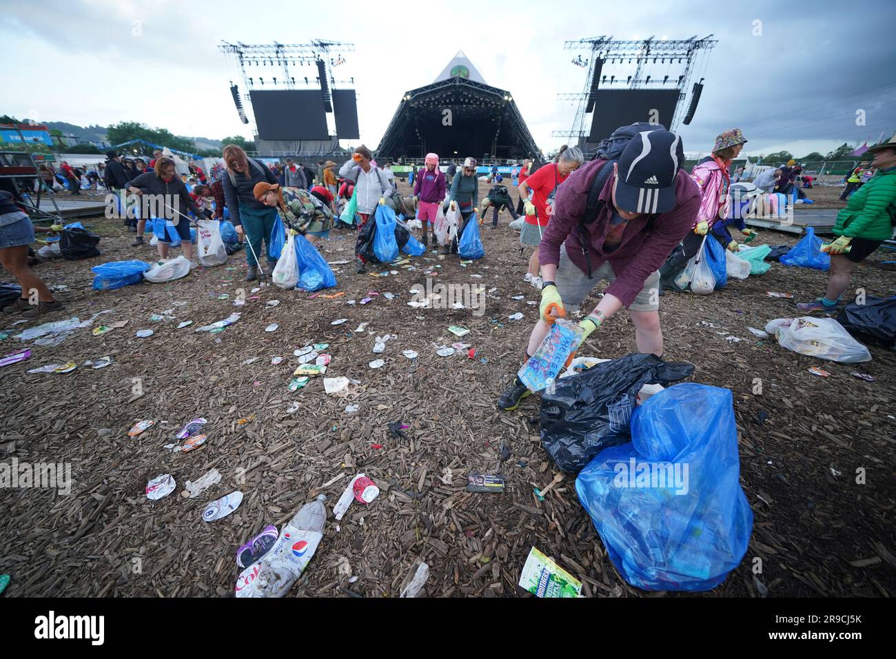 People seen during the clean up operation at the Glastonbury Festival ...