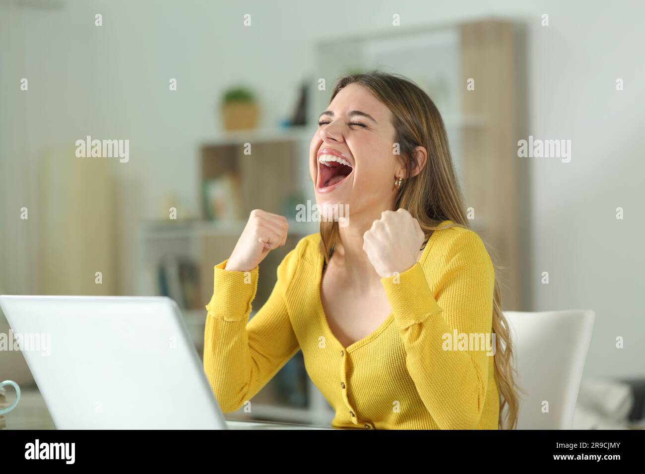 Excited woman computer home hi-res stock photography and images - Alamy
