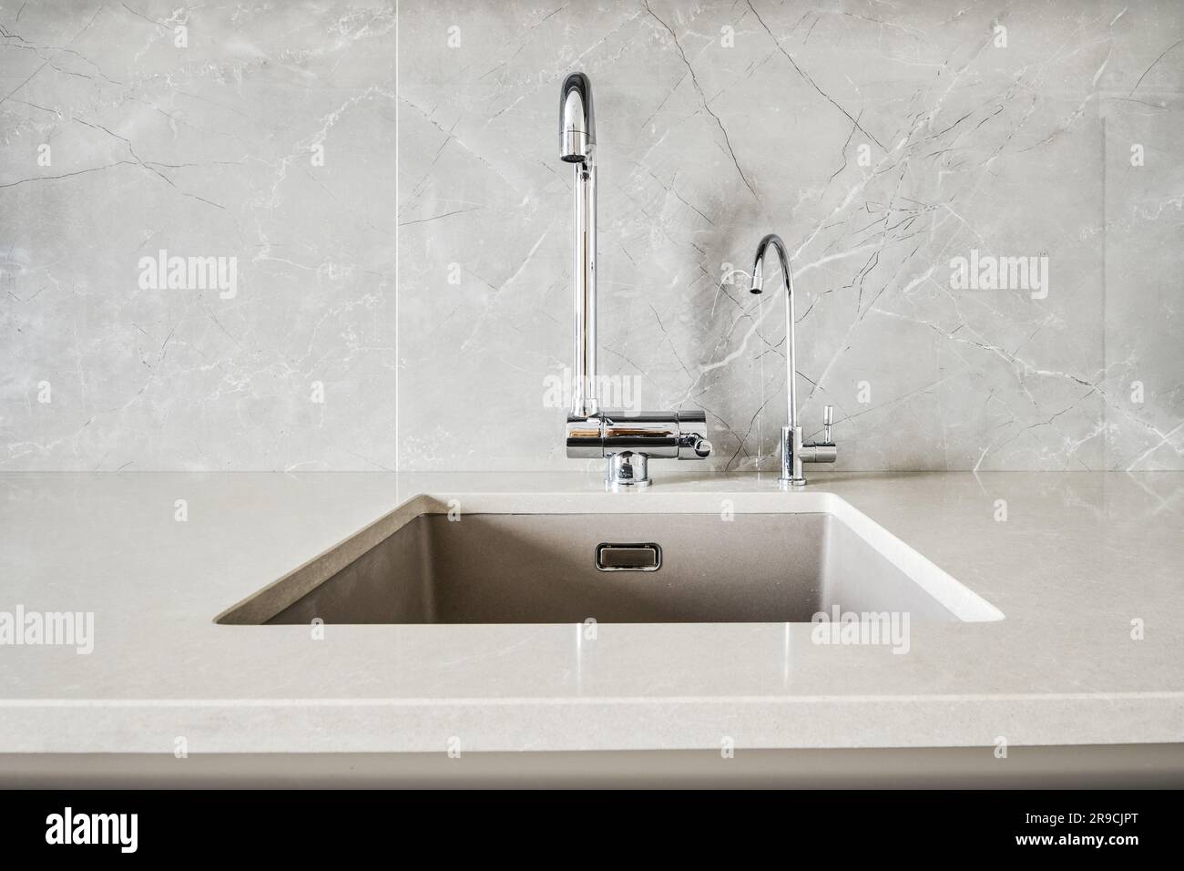 Front view of an elegant stone sink and water tap for pure water Stock ...