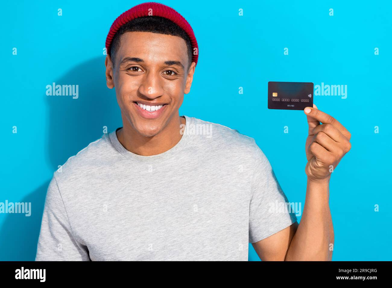 Photo of friendly positive person toothy smile hand hold demonstrate ...