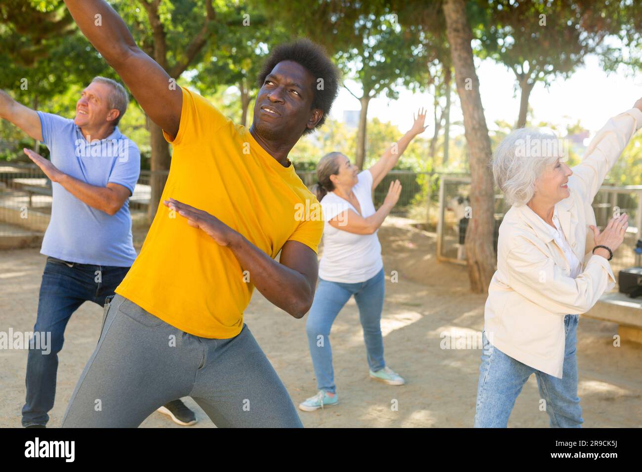 Group of happy multiracial adult people of different age working out ...