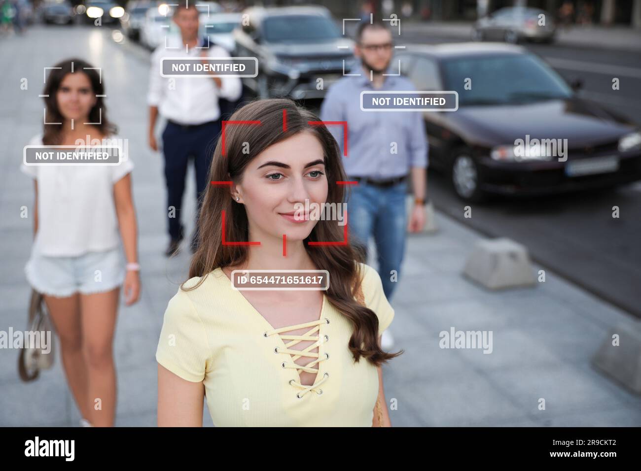 Facial recognition system identifying people on city street. Woman and ...