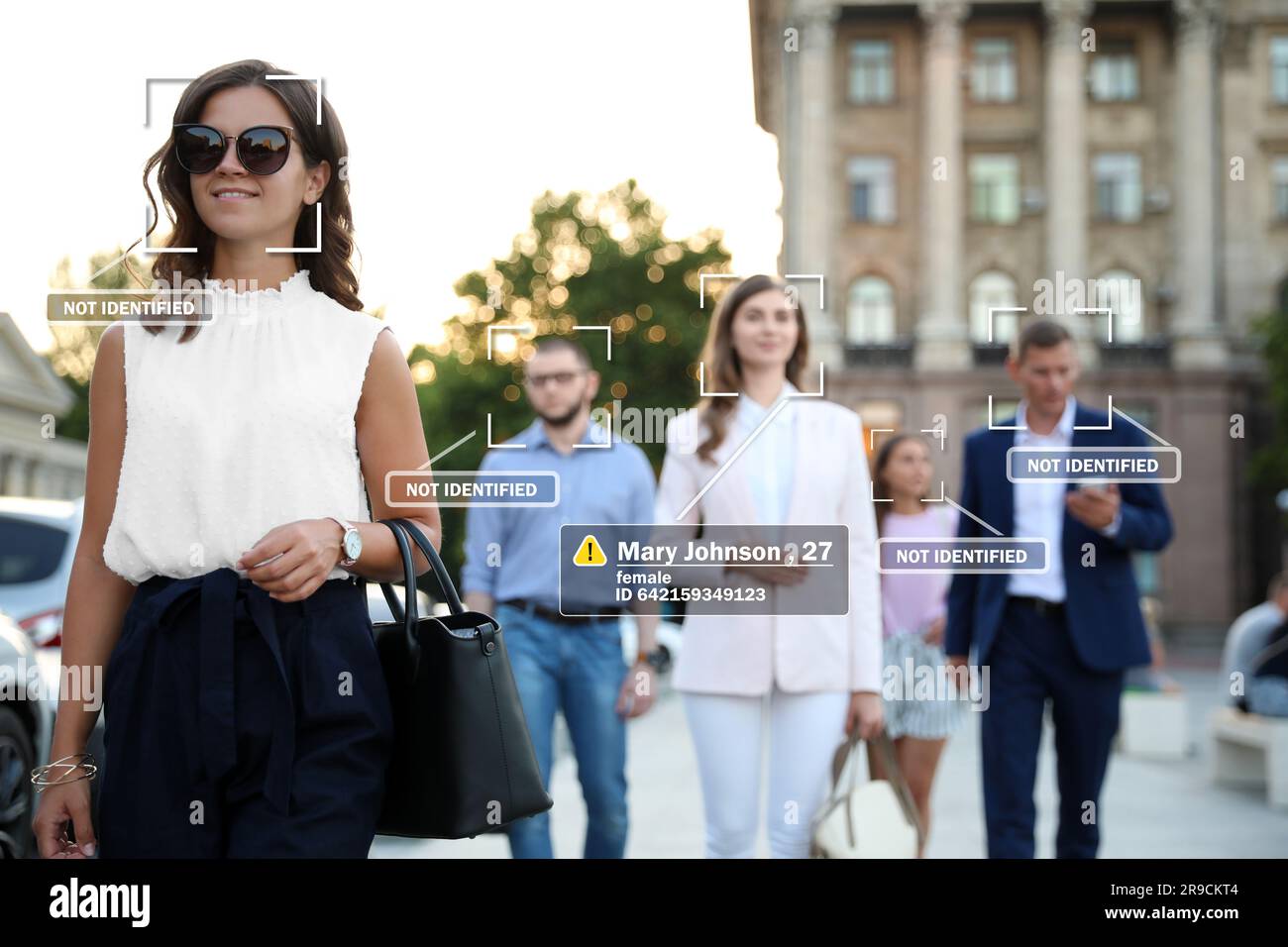 Facial recognition system identifying people on city street. AI giving ...