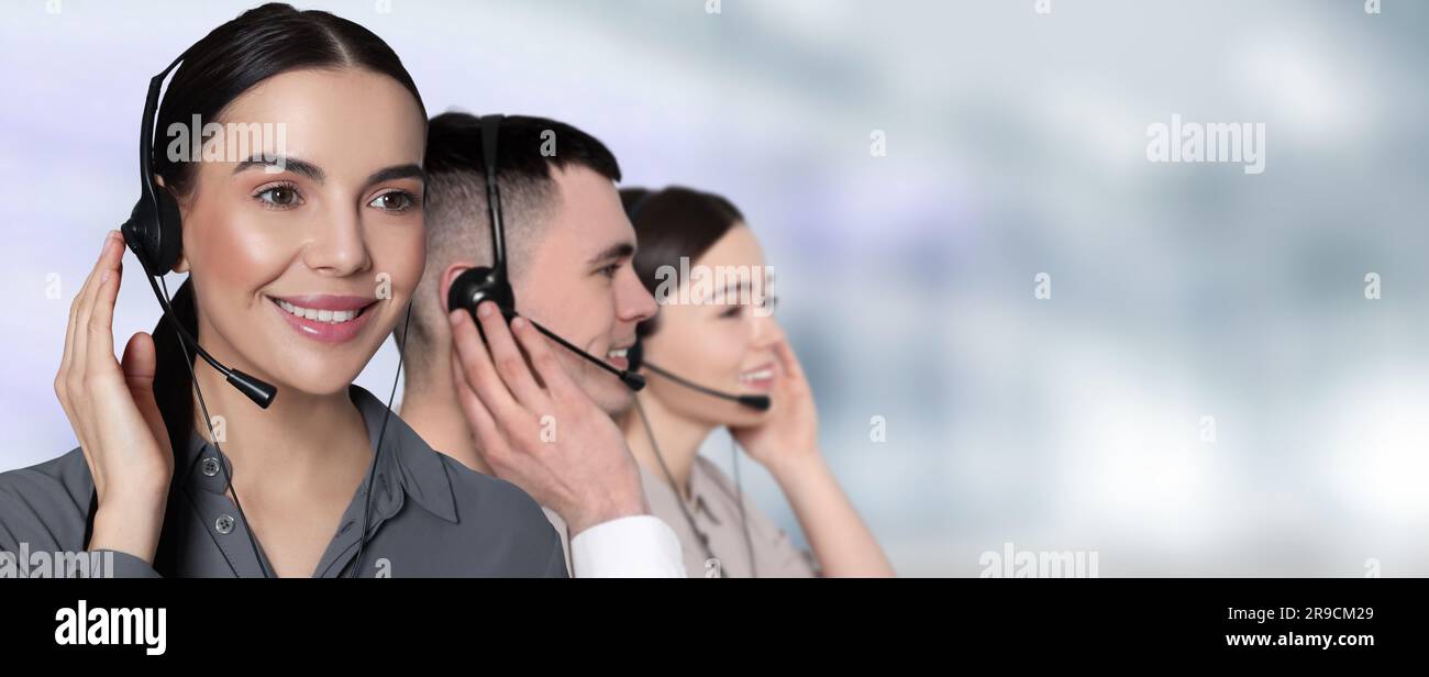 Hotline operators with headsets in office, space for text. Banner ...
