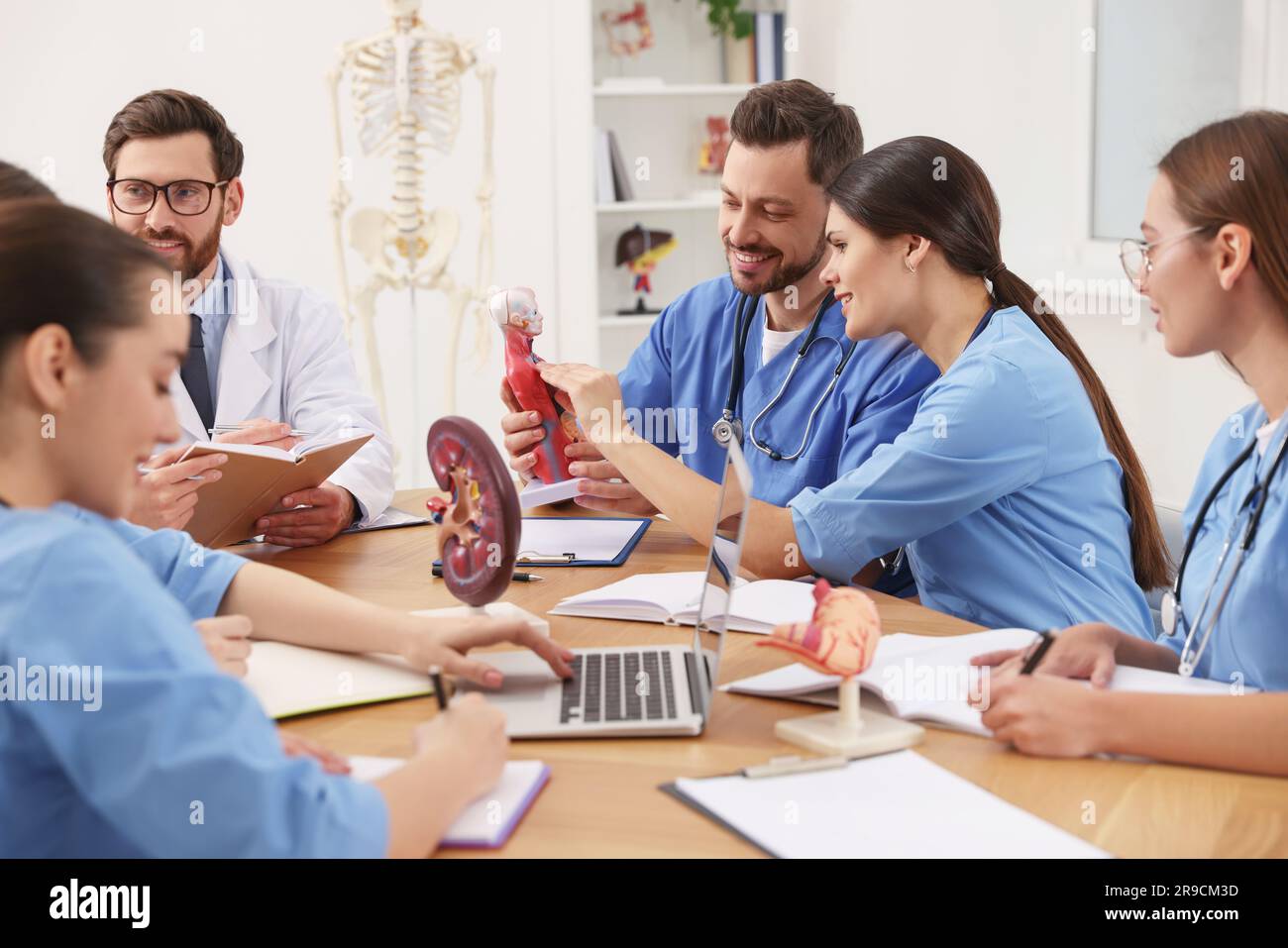 Medical students in uniforms studying at university Stock Photo - Alamy