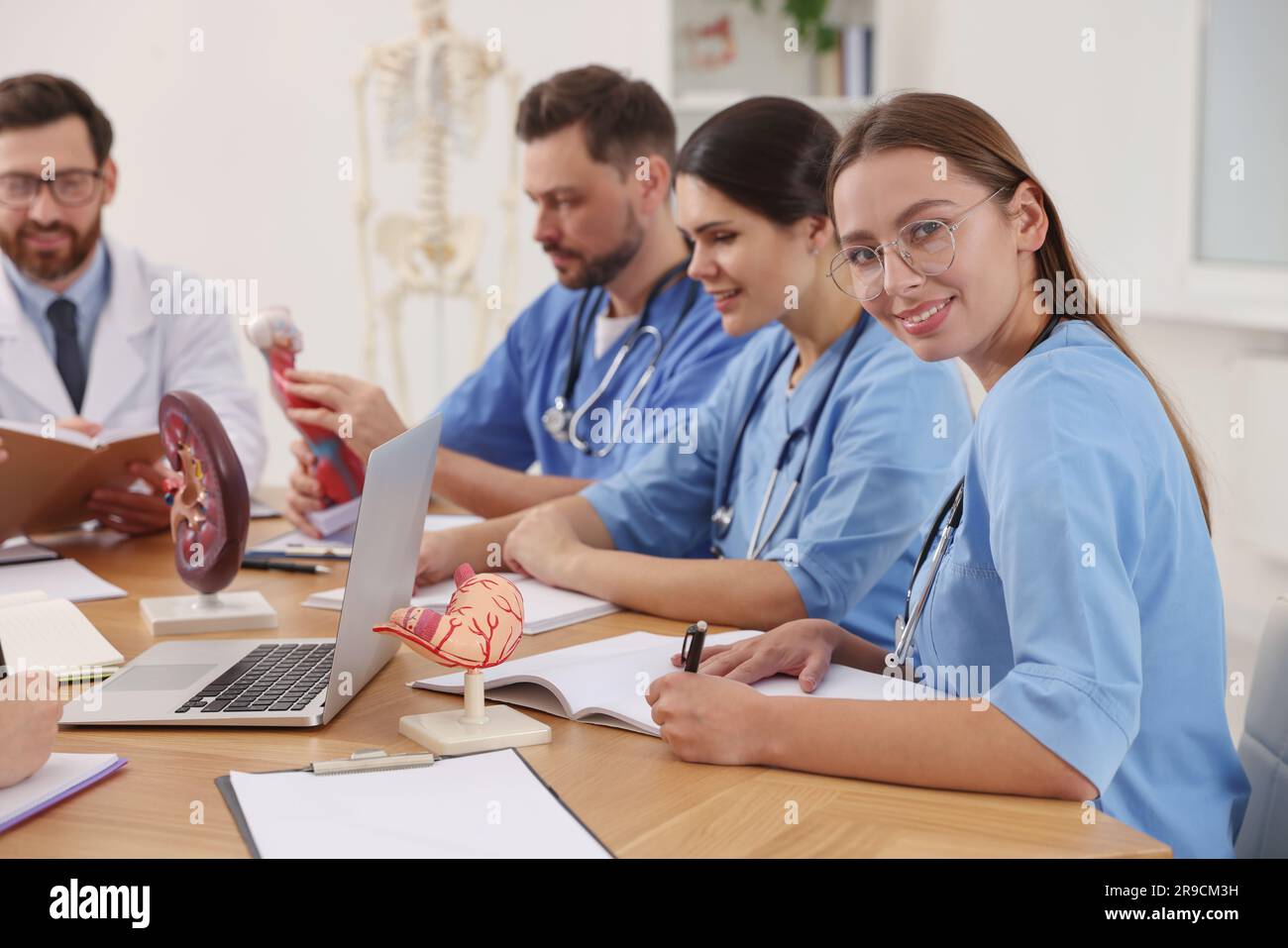 Medical students in uniforms studying at university Stock Photo - Alamy