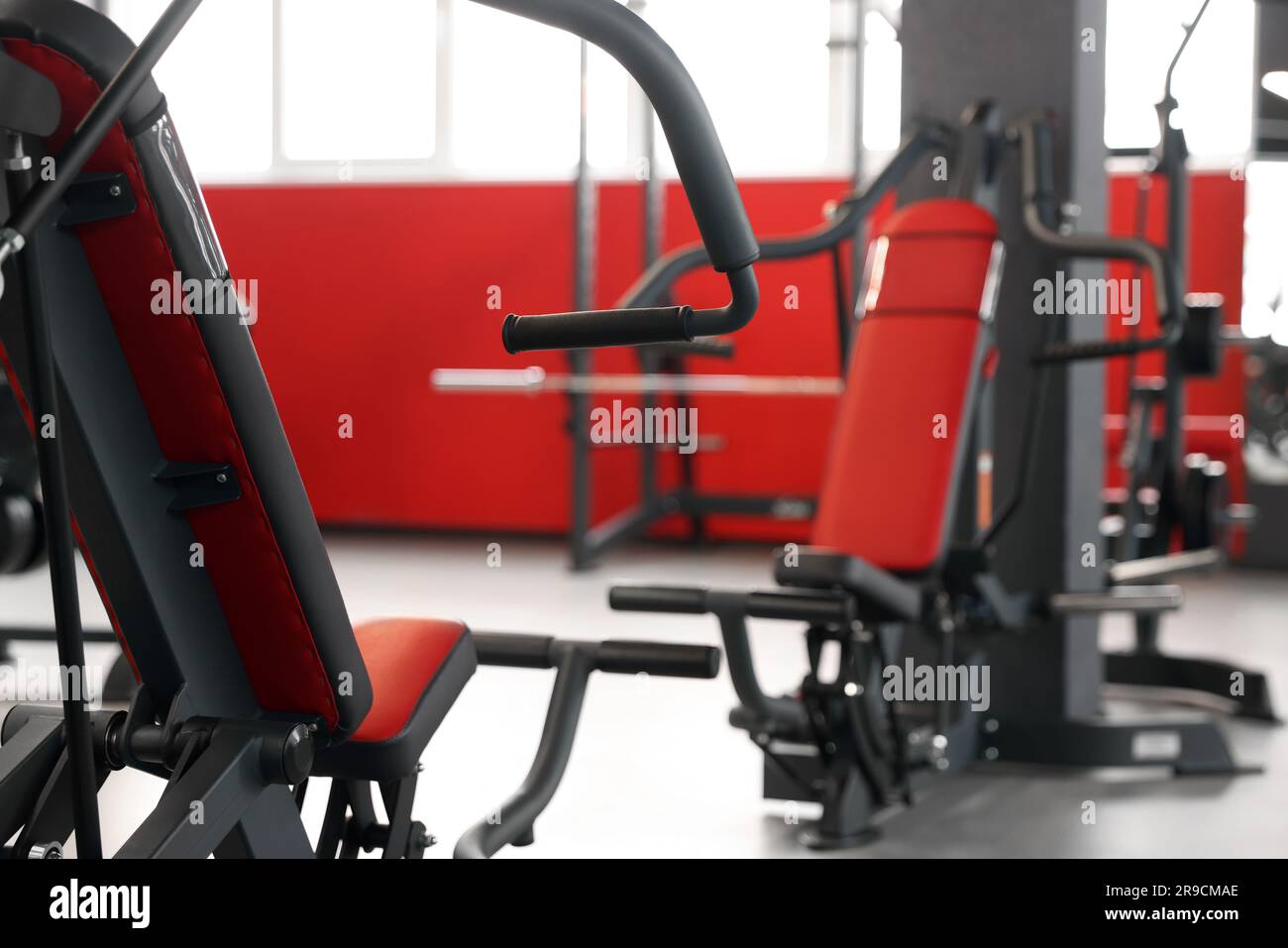 Professional plate loaded machine in modern gym Stock Photo - Alamy