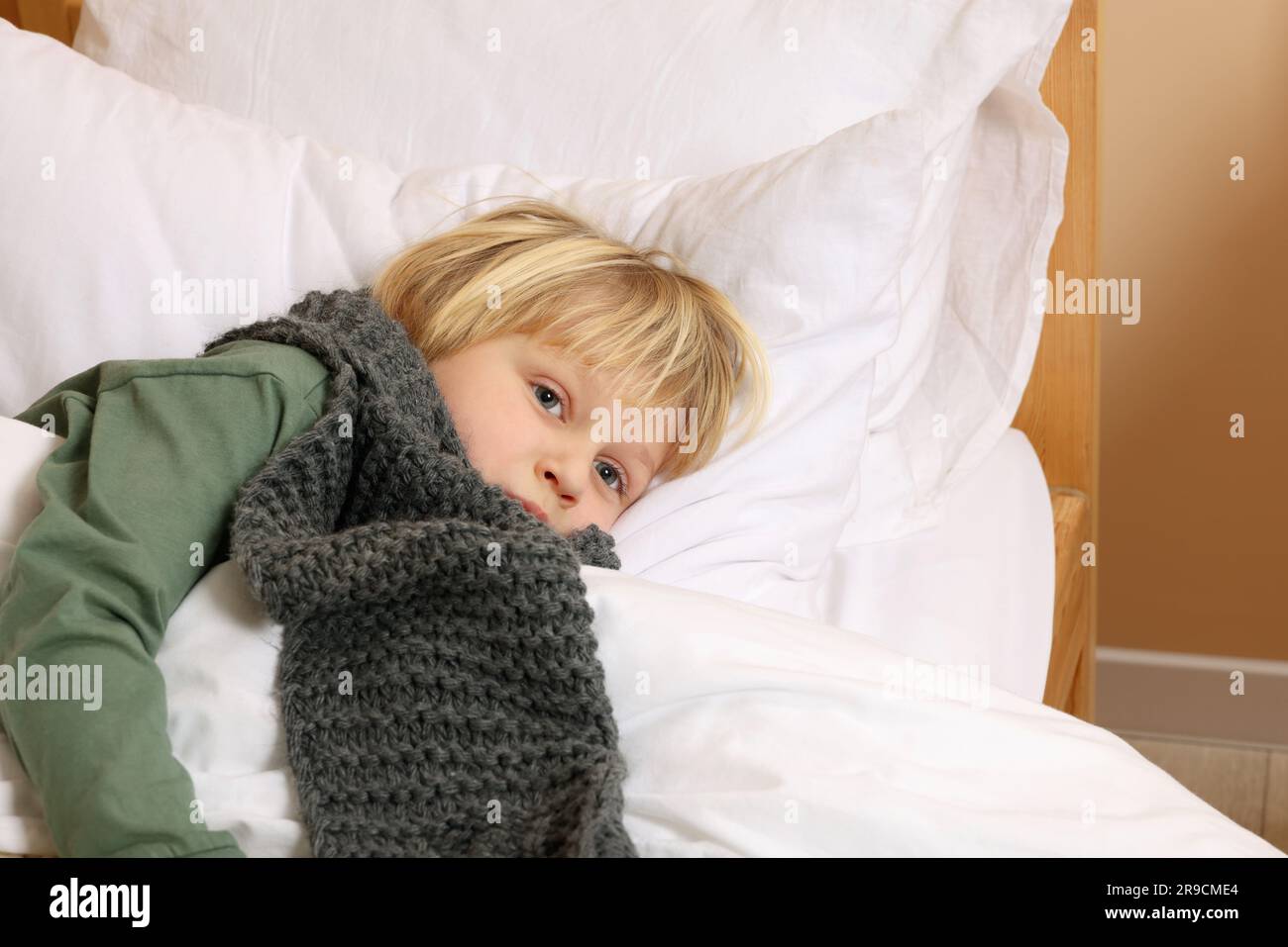 Sick child boy lying hi-res stock photography and images - Alamy