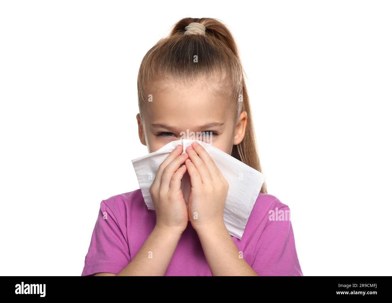 Sick girl blowing nose in tissue on white background. Cold symptoms ...