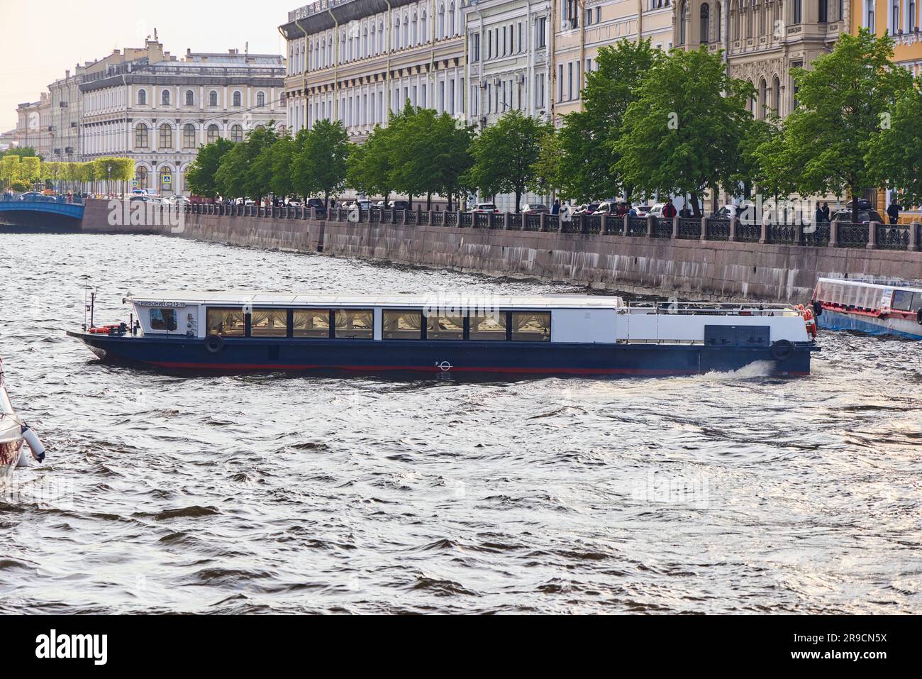 Tourist boat in the river in the city Stock Photo - Alamy