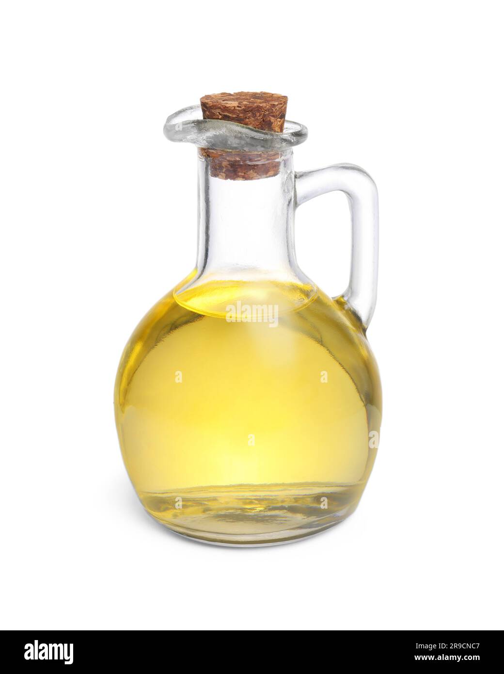 Glass jug of cooking oil isolated on white Stock Photo - Alamy