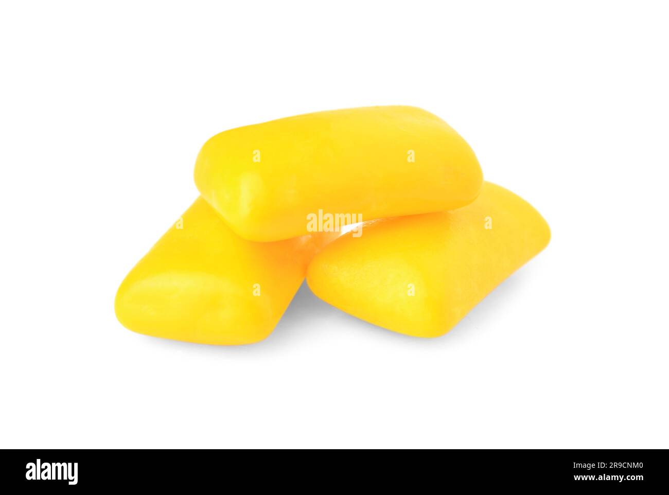 Tasty yellow chewing gums isolated on white Stock Photo - Alamy